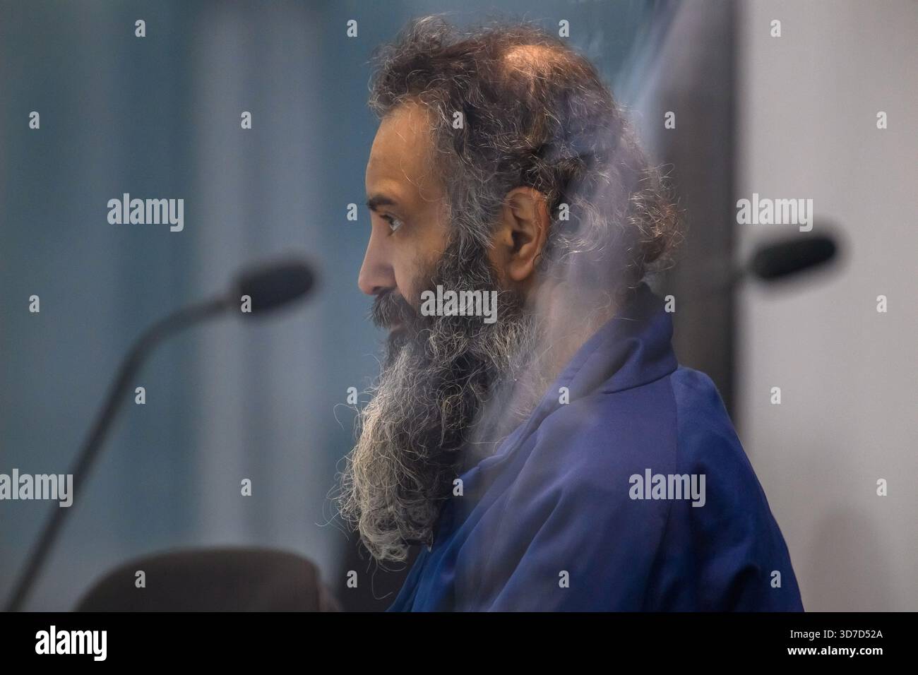 Taleb al-Abdulmohsen sits in a glass box during the trial at the ...