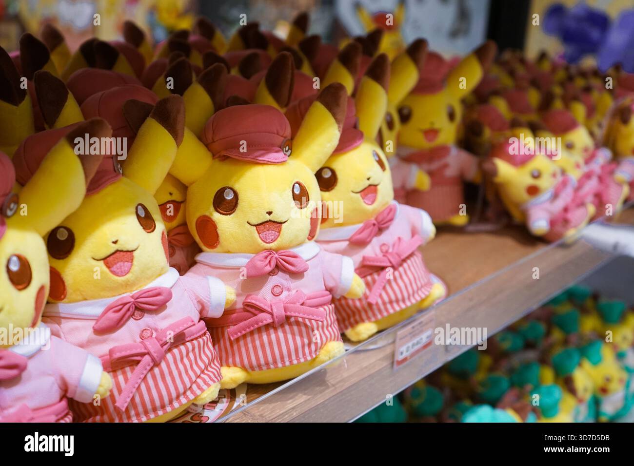Shelf of exclusive Pink Patisserie Pikachu stuffed dolls at the Pokemon ...