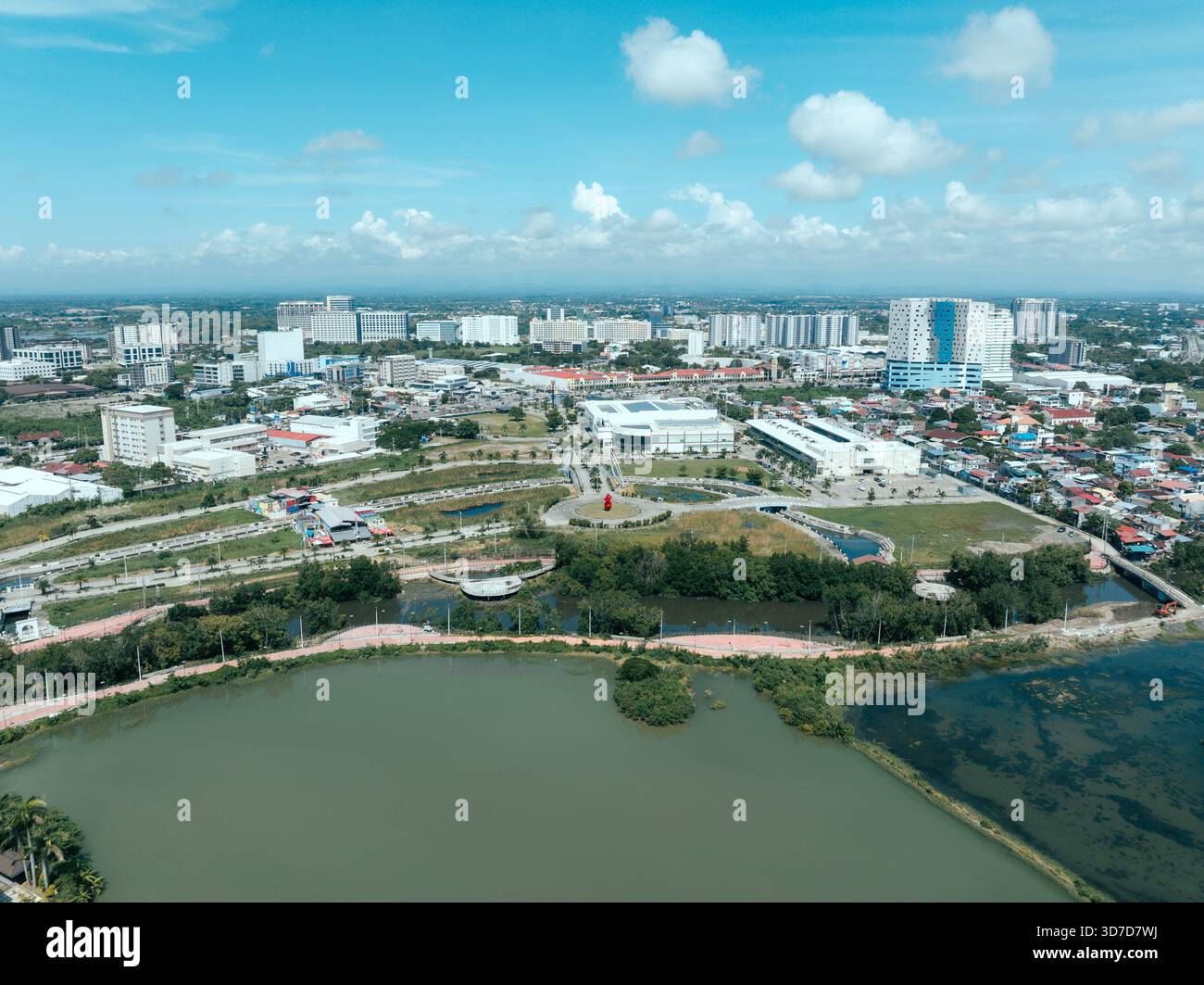 Aerial view of green spaces meeting urban development near the Iloilo ...