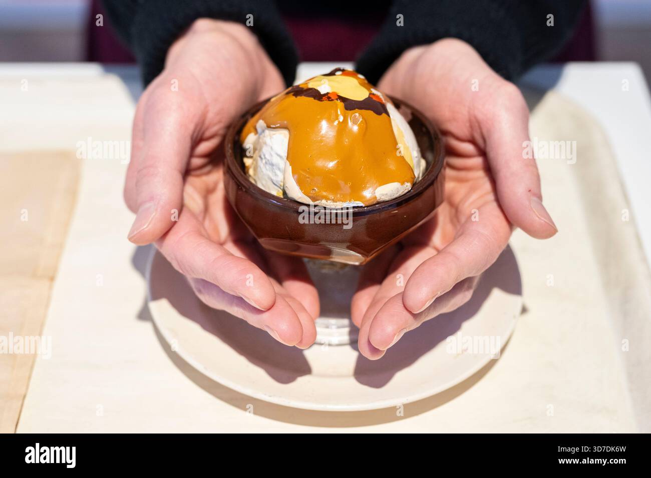 London, UK. 25 November 2025. A staff member with 'Ice Cream Sundae on ...