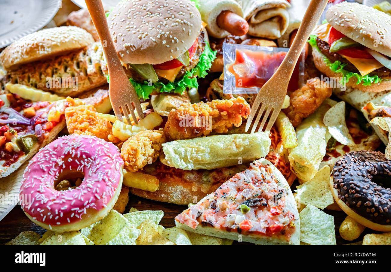Fast food leftovers. Wasted food Stock Photo - Alamy