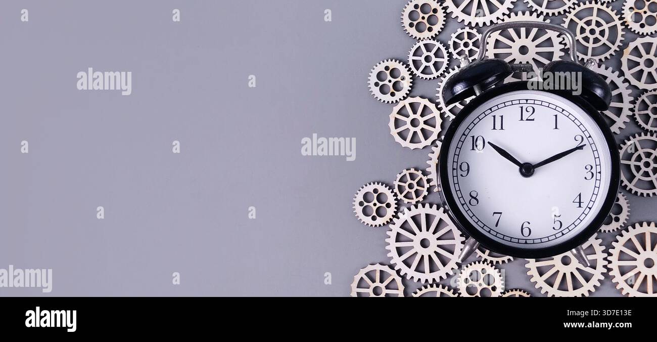 Alarm Clock and Wooden Gears Representing Time Management, Engineering ...