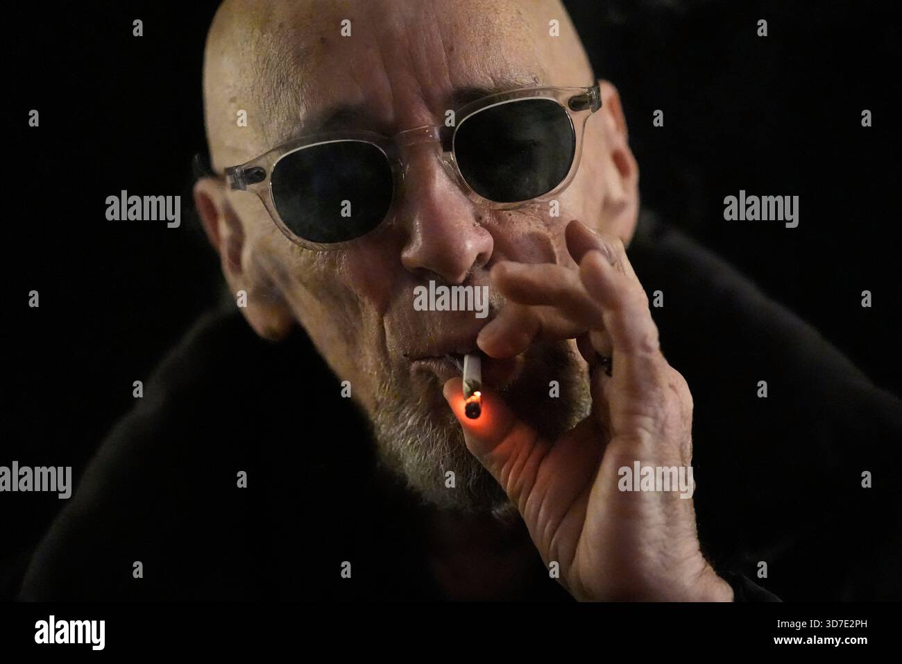 Miguel Laboy takes a hit of a joint Friday, Nov. 14, 2025, in Brookline ...