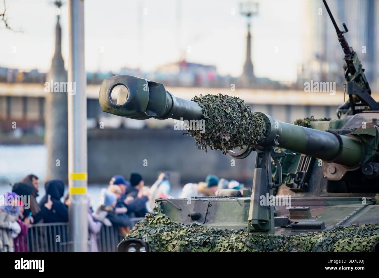 Camouflaged NATO tank featuring large barrel assembly, reinforced ...