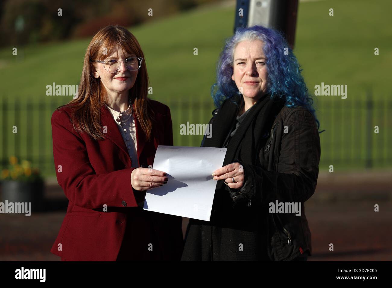 Economy Minister Dr Caoimhe Archibald (left) receives a letter from the Chair of the NIC ICTU ...