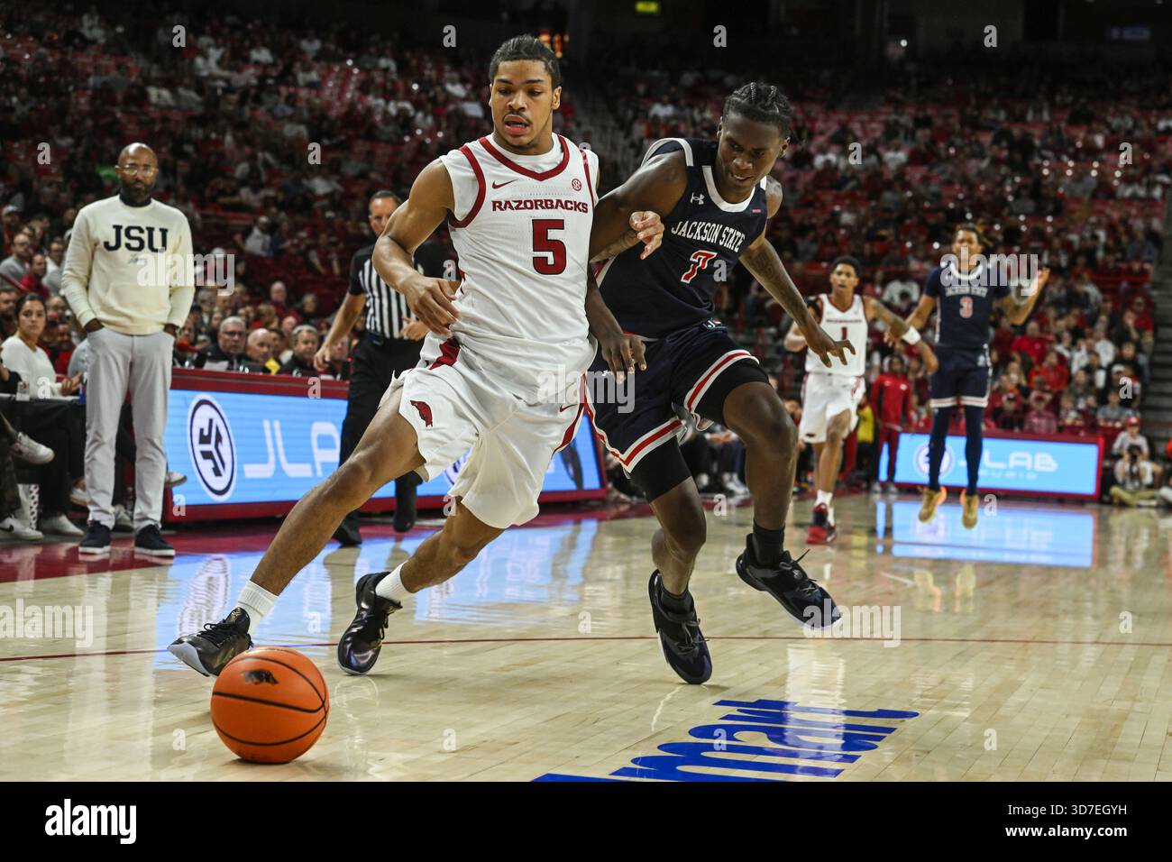 Arkansas guard Darius Acuff Jr. (5) and Jackson State forward Kedrick ...