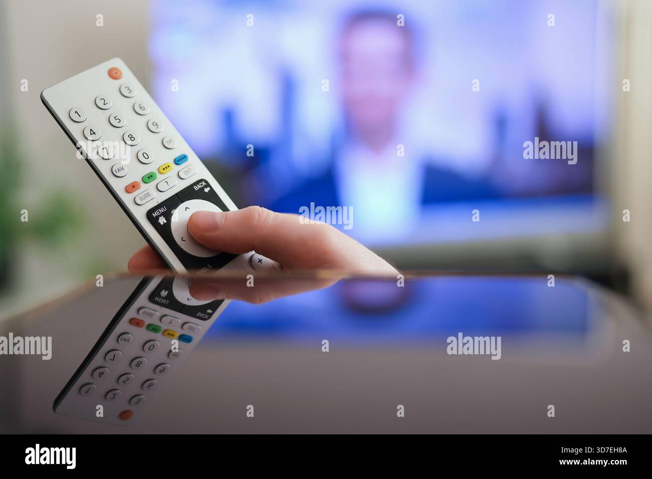 ILLUSTRATION - 25 November 2025, Hamburg: A man presses a button on the ...