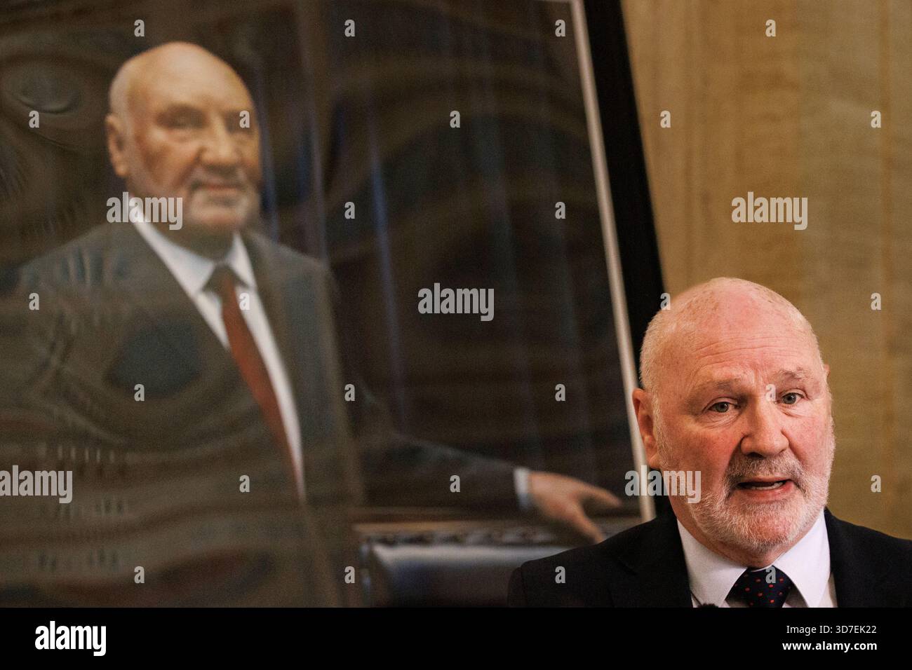 Former Stormont speaker Alex Maskey in front of a portrait of him by ...