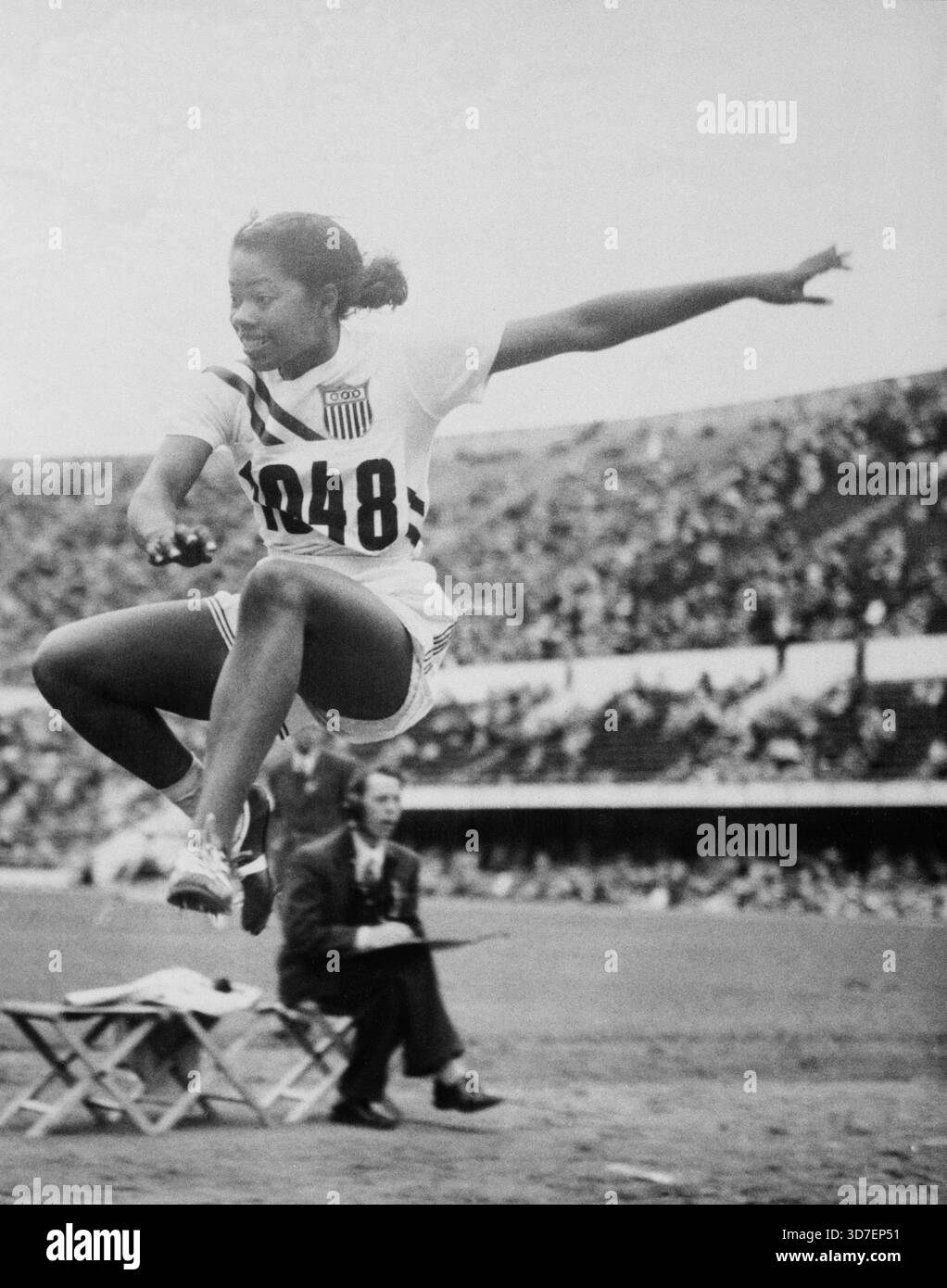 Mabel Landry, of Chicago, Ill., sails through the air during the ...