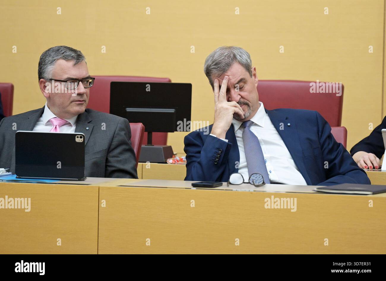 25 November 2025, Bavaria, Munich: Florian Herrmann (CSU, l.), Head of ...