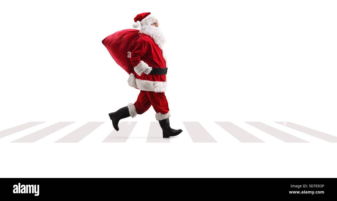 Santa claus running with a sack over zebra crossing isolated on white ...