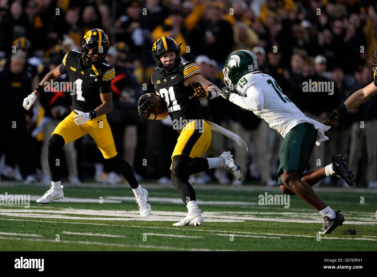 Iowa wide receiver Kaden Wetjen (21) returns a punt for a touchdown ...