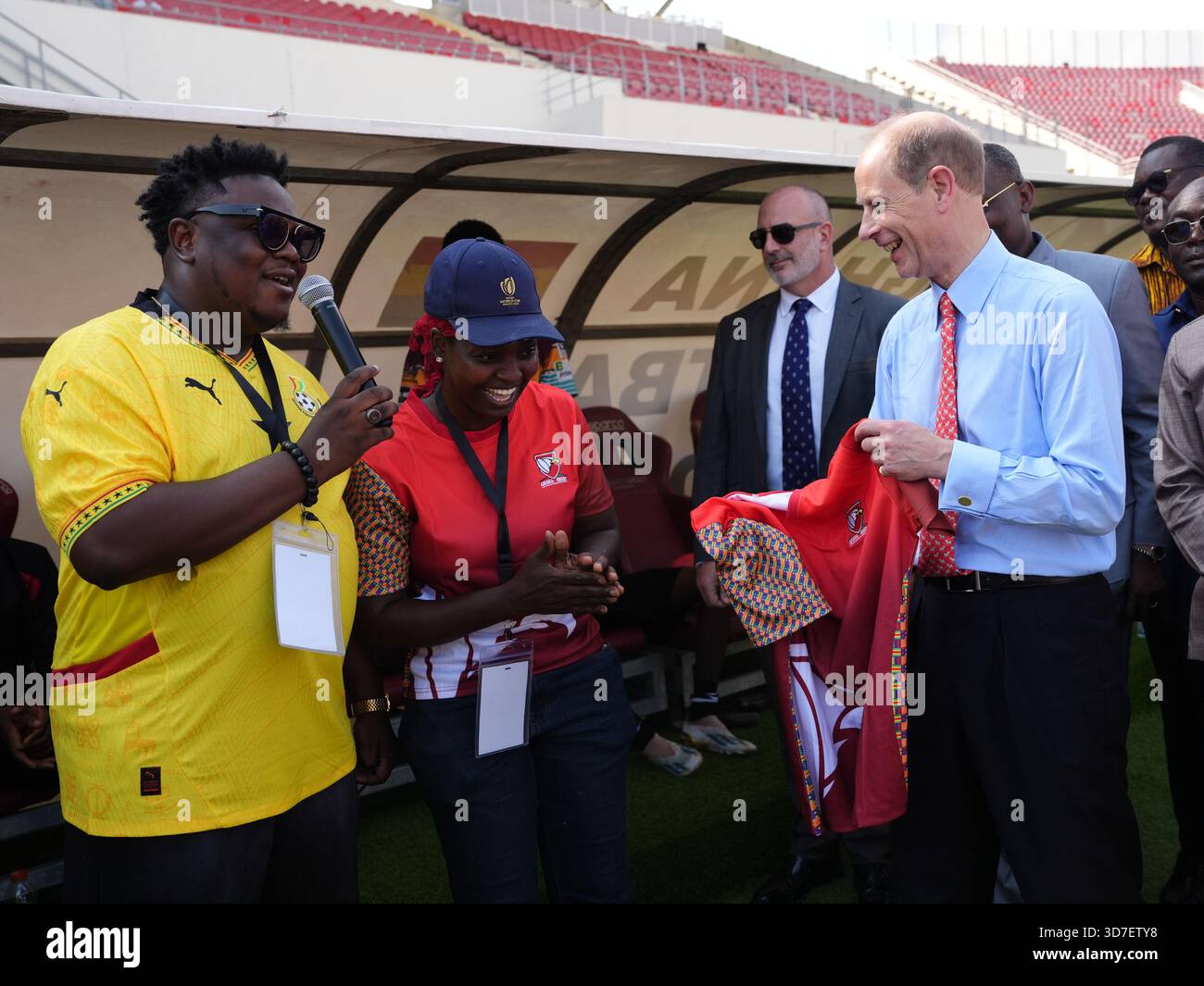 The Duke of Edinburgh is presented with a replica jersey from a member ...