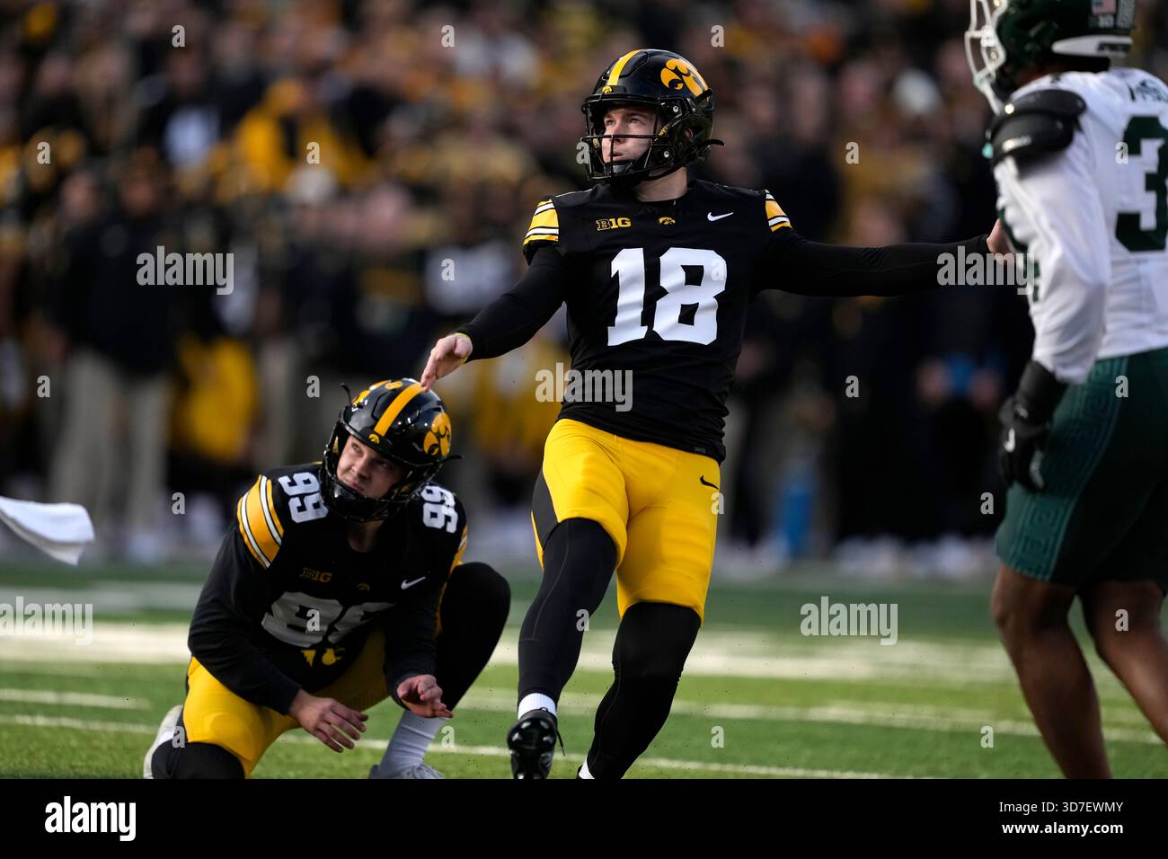 Iowa kicker Drew Stevens (18) kicks a field goal during the first half ...
