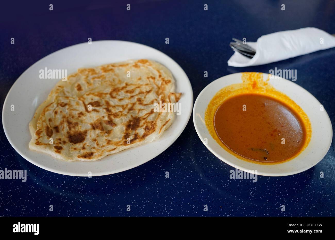 Simple breakfast in Malaysia with Roti Canai served with dal curry ...