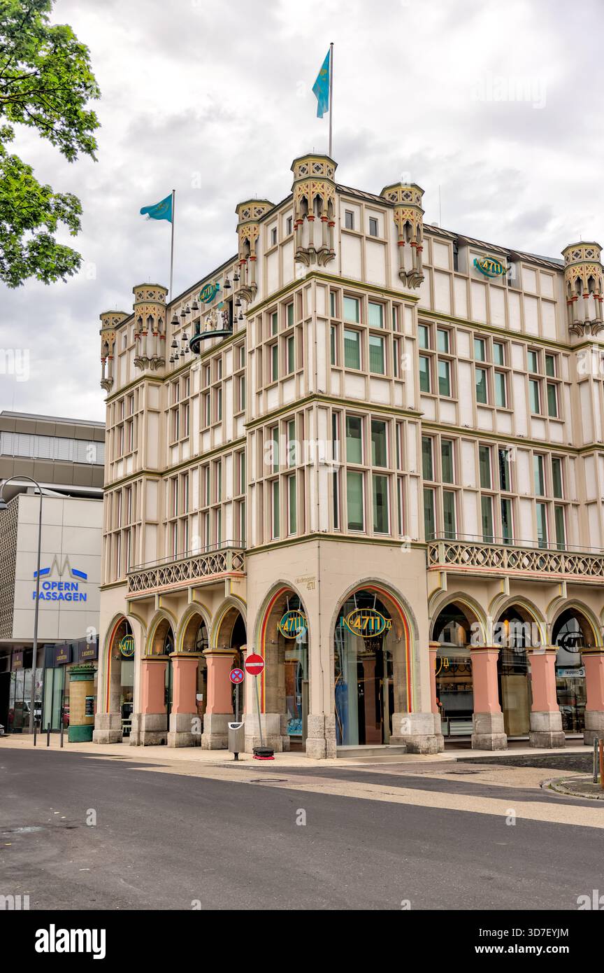 Historic multi-storey building with ornate arched façade and columns in ...