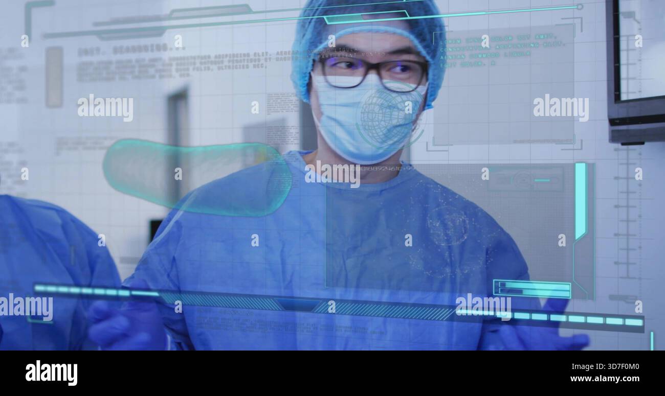Viewing mature male clinician in blue surgical PPE studying holographic ...