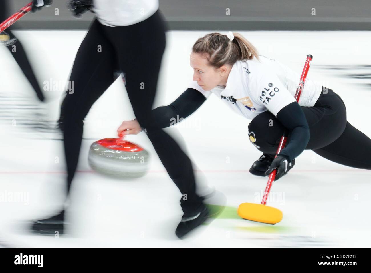 Rachel Homan, right, throws a rock during Canadian Olympic curling ...