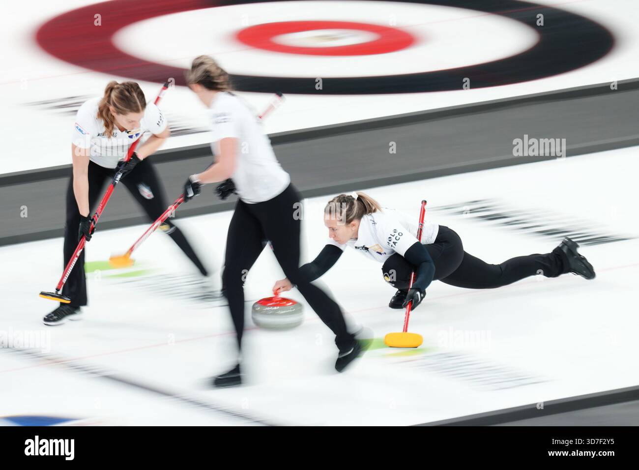 Rachel Homan, right, throws a rock during Canadian Olympic curling ...