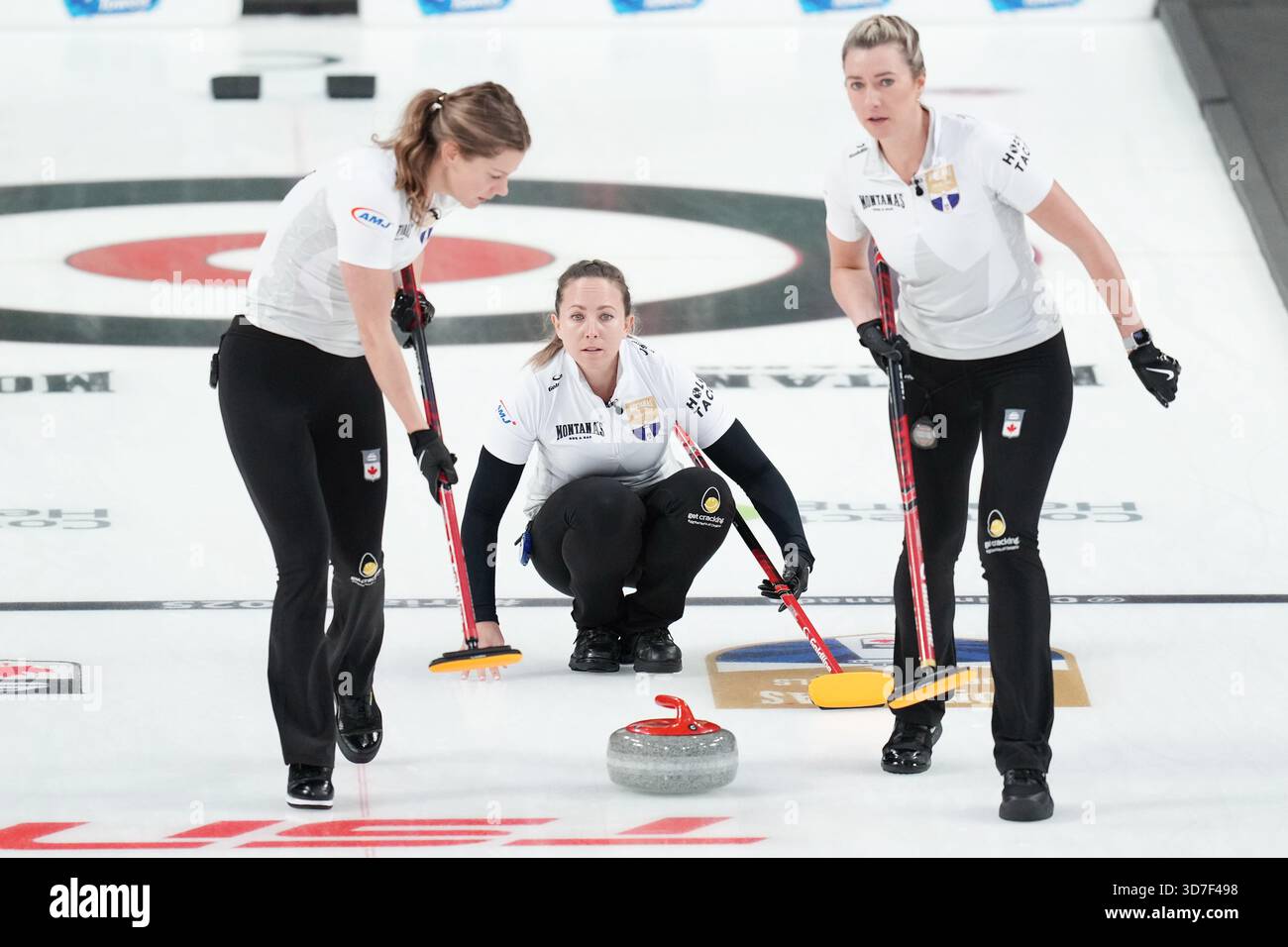 Rachel Homan, centre, throws a rock during Canadian Olympic curling ...
