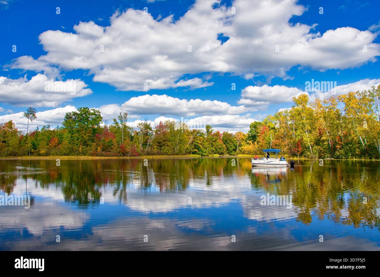Calm early autumn day at Caldron Falls Reservoir in northern Wisconsin ...