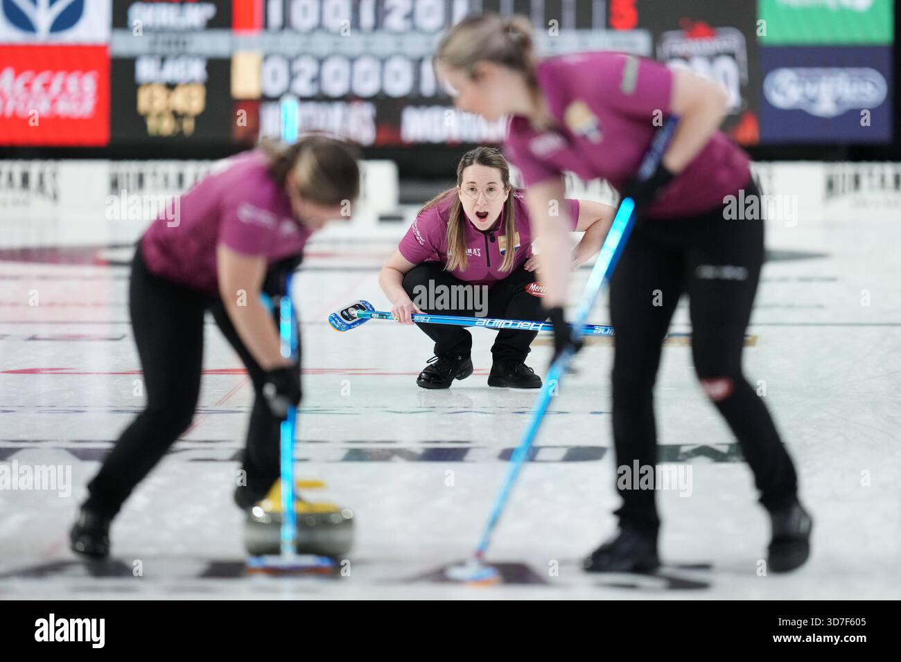 Christina Black yells directions to teammates after throwing a rock ...