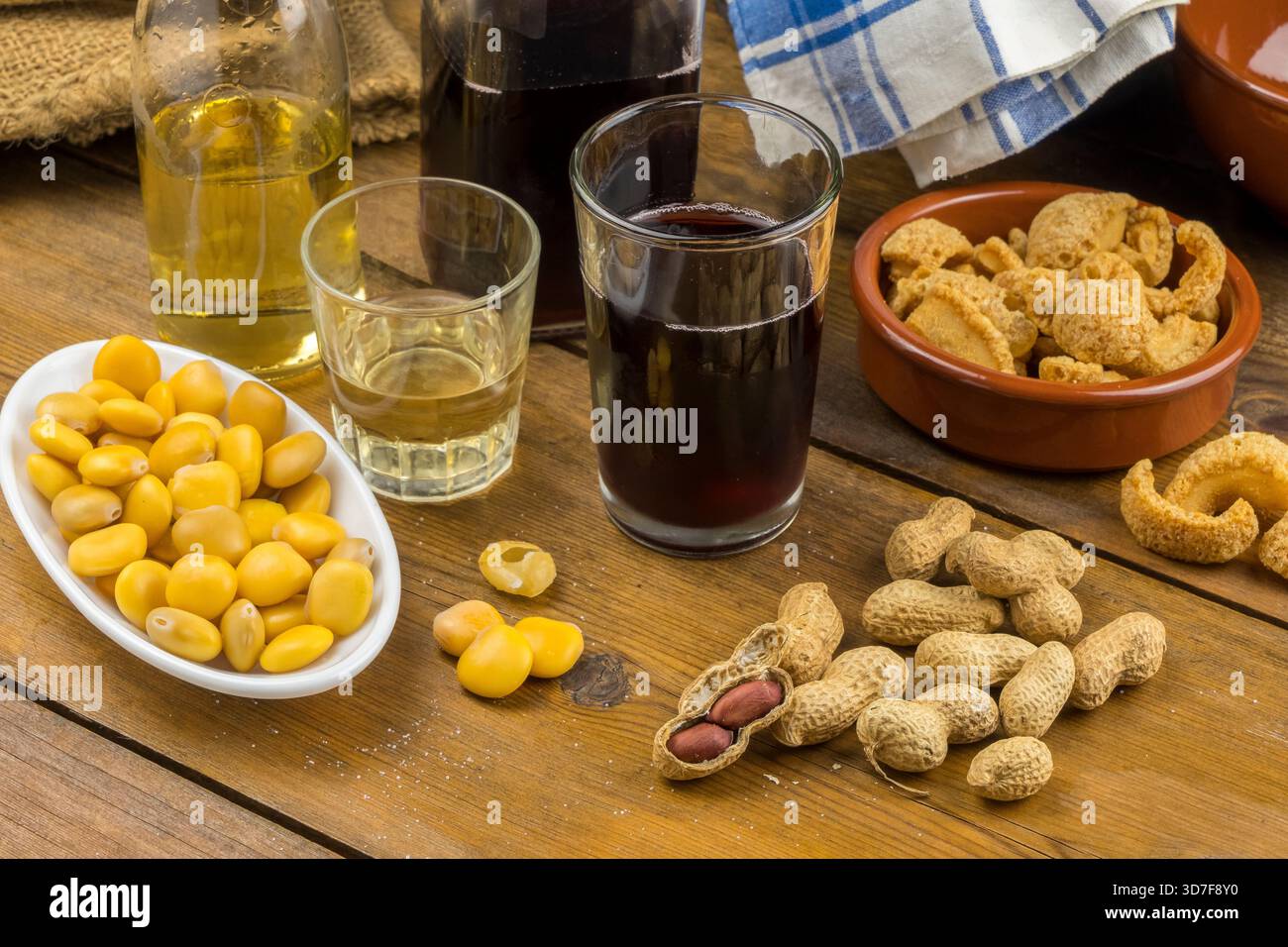 Lupins, peanuts and pork rinds with white and red wines, appetizers ...