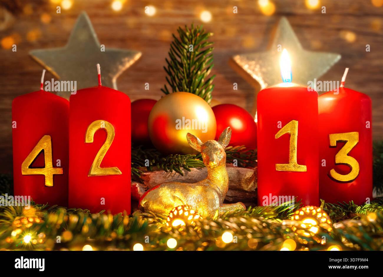 Bavaria, Germany - November 24, 2025: A single burning red Advent ...