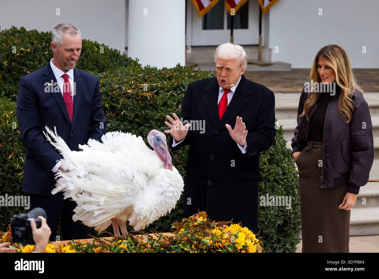 US President Donald Trump (C) pardons a turkey named Gobble while and ...