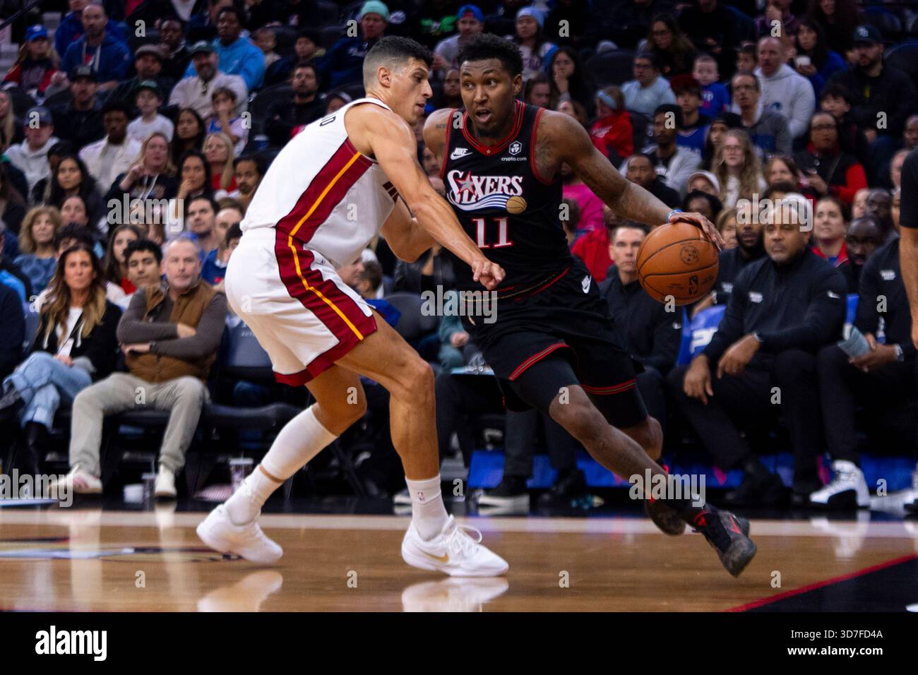 Philadelphia 76ers' Justin Edwards, right, in action gains Miami Heat's ...