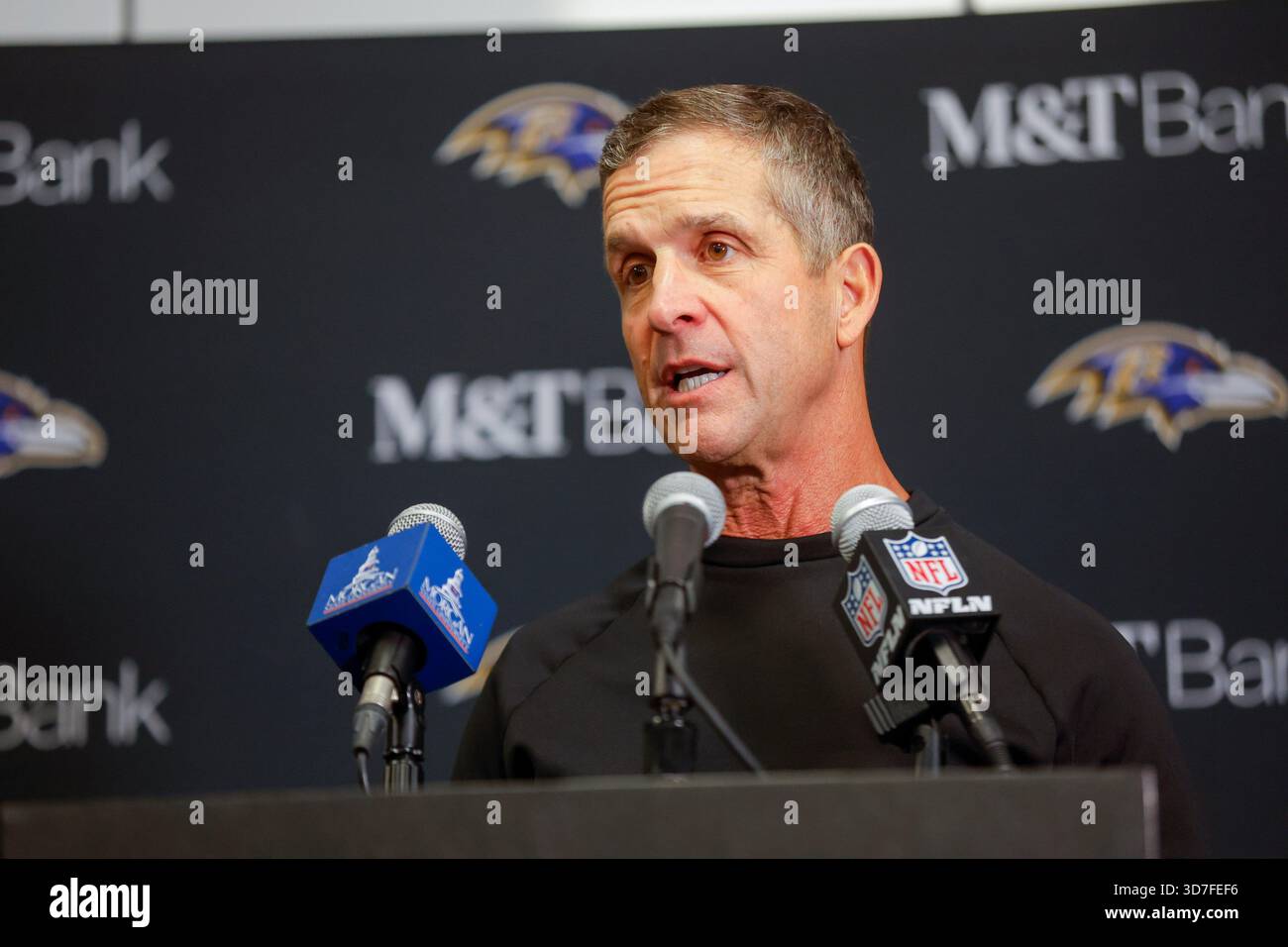 Baltimore Ravens head coach John Harbaugh talks to reporters after an ...