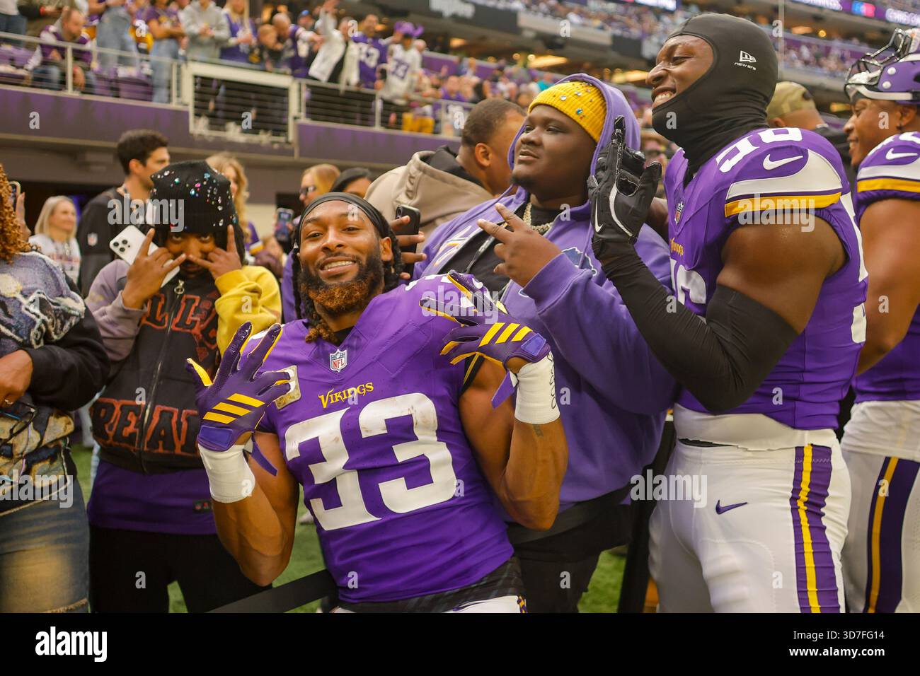 Minnesota Vikings running back Aaron Jones (33) and linebacker Austin ...