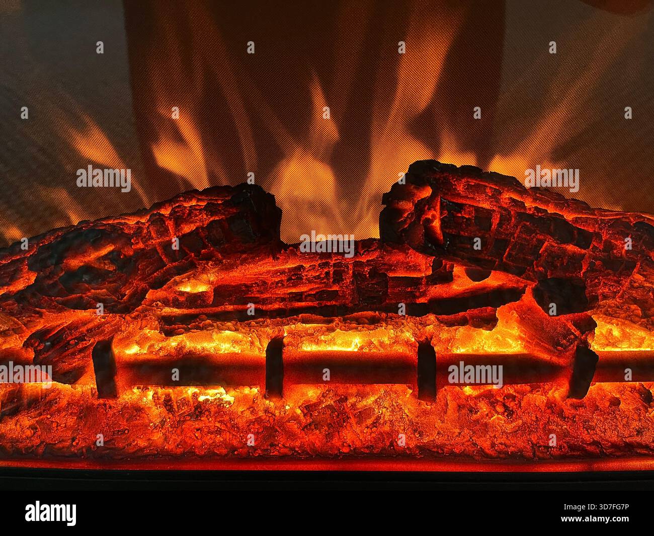 Realistic Artificial Fireplace Logs with Glowing Flames Creating a Warm ...