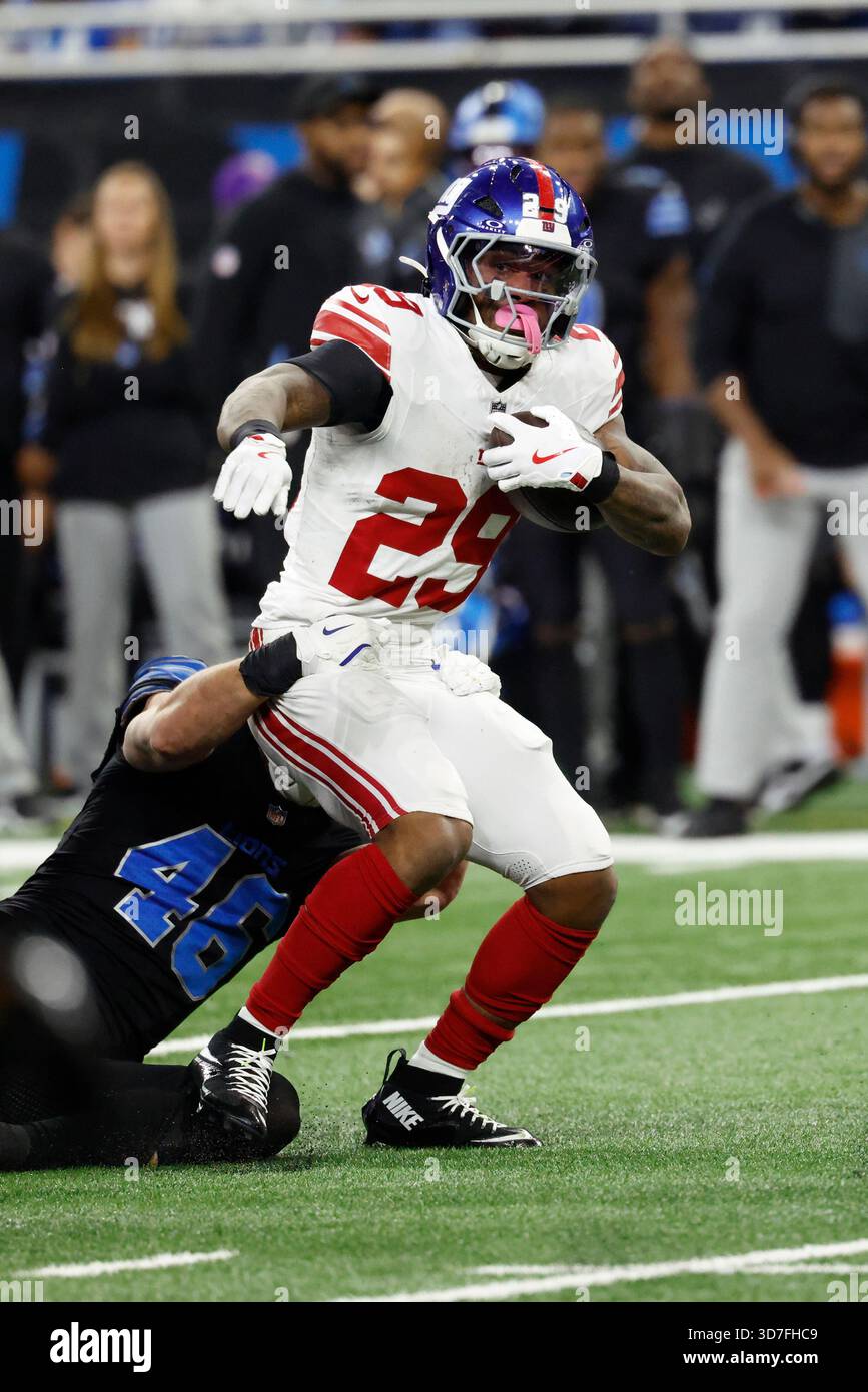 New York Giants running back Tyrone Tracy Jr. (29) is tackled by ...