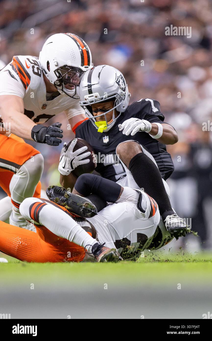 Las Vegas Raiders wide receiver Tre Tucker (1) is tackled against the ...