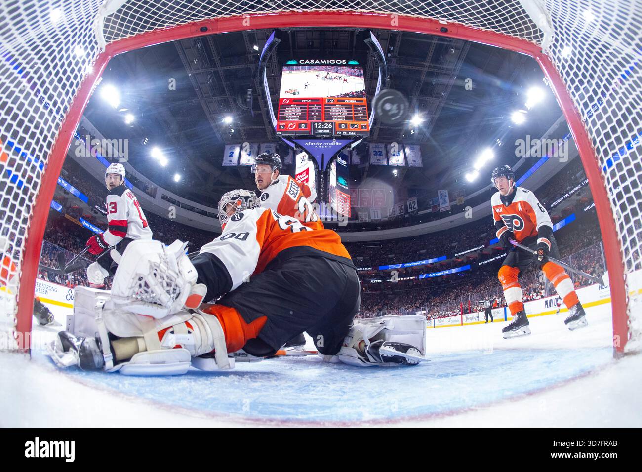 Philadelphia Flyers' Dan Vladar, center left and Nick Seeler, center ...