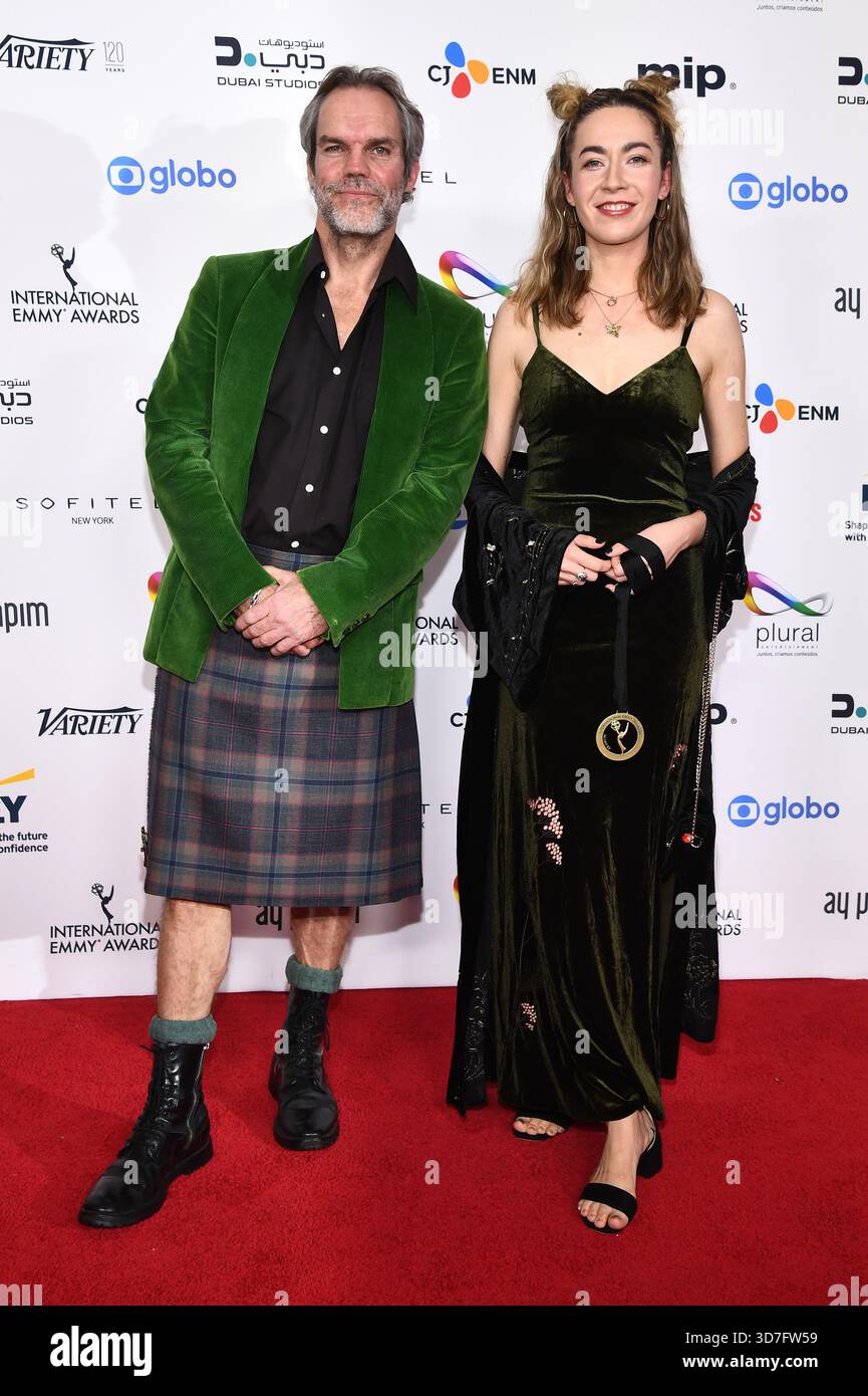 (L-R) Colin Barr and Adriana Timco (UK) walking the red carpet at the ...