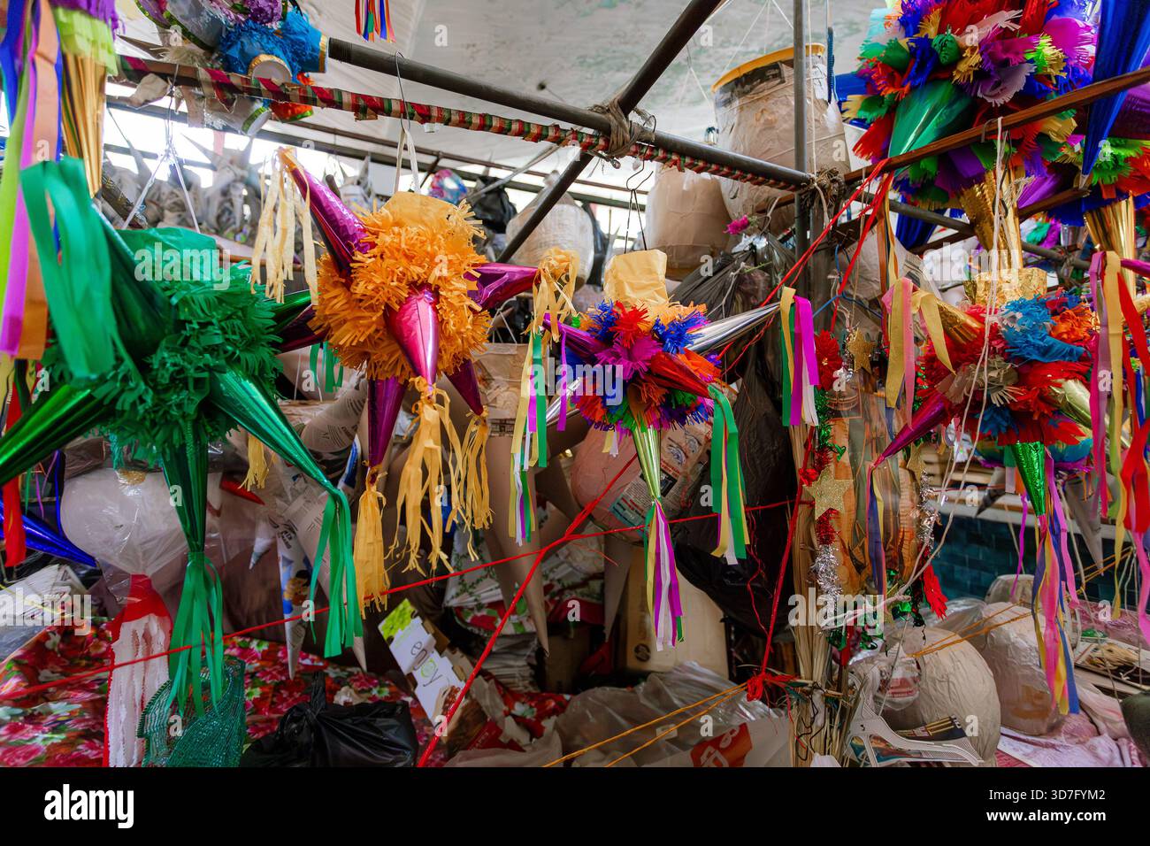 Close view of two traditional Mexican star piñatas with silver peaks ...