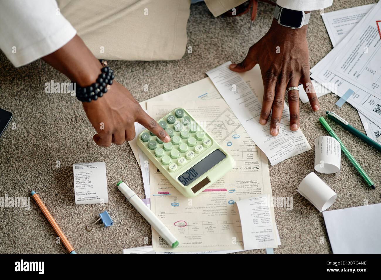 Young Black Man Calculating Expenses While Analyzing Bills and Invoices ...