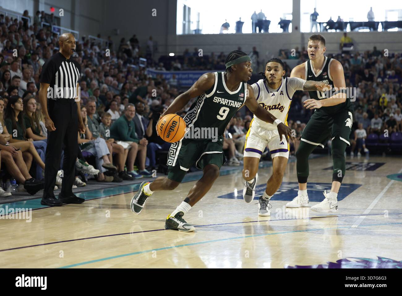 Michigan State guard Trey Fort (9) handles the ball against East ...