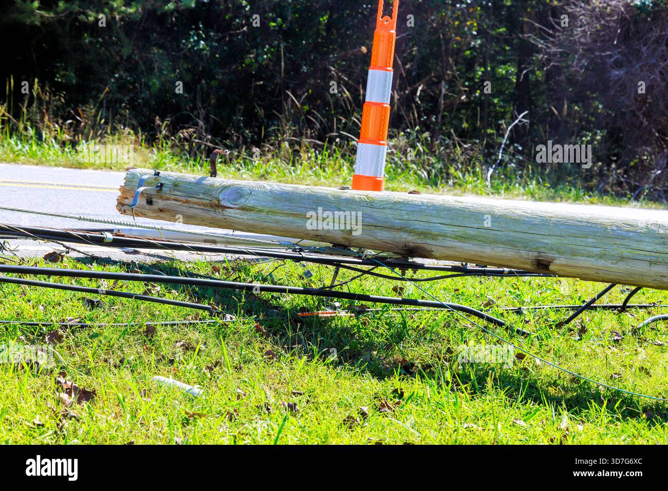 Broken utility pole lies hi-res stock photography and images - Alamy