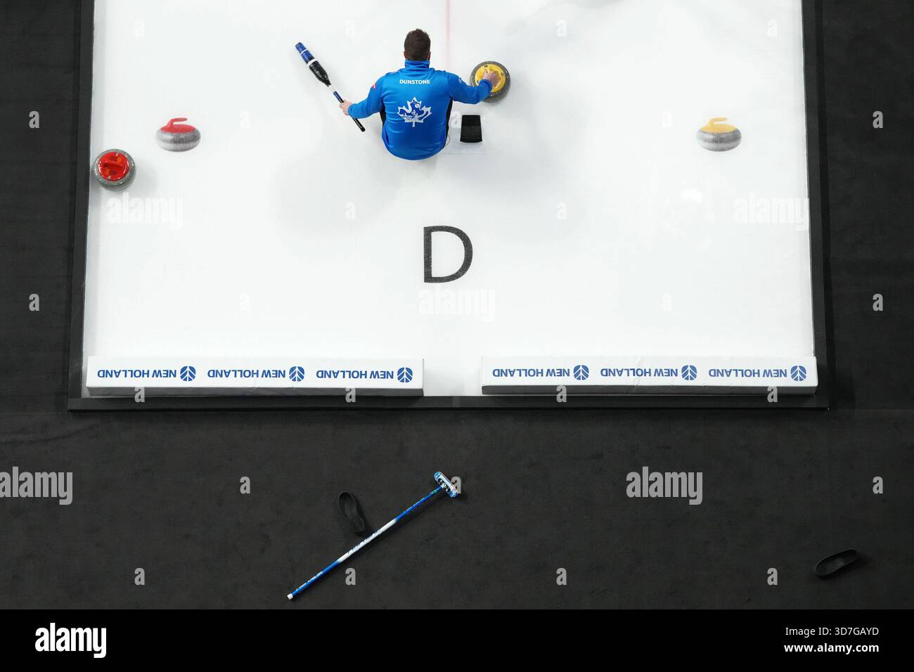 Matt Dunstone prepares to throw a rock during Canadian Olympic curling ...