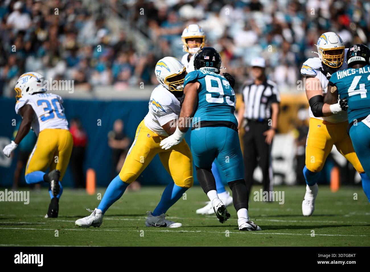 Los Angeles Chargers guard Zion Johnson (77) blocks against ...