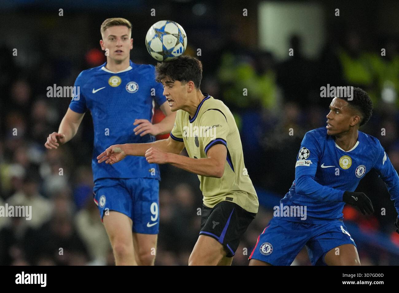 Barcelona's Pau Cubarsi, center, heads the ball past Chelsea's Estevao ...