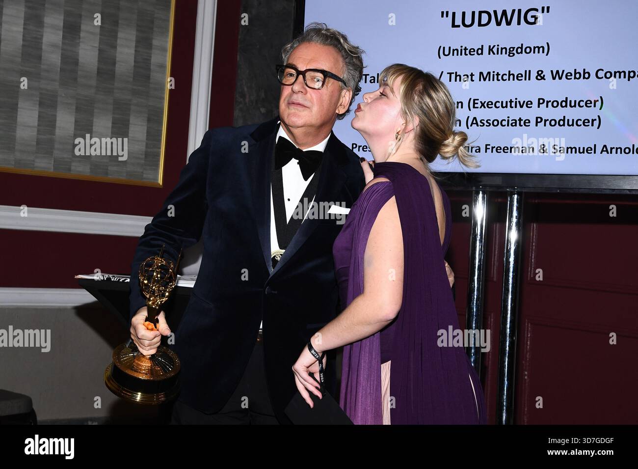 British executive producer Kenton Allen and British producer pose in ...