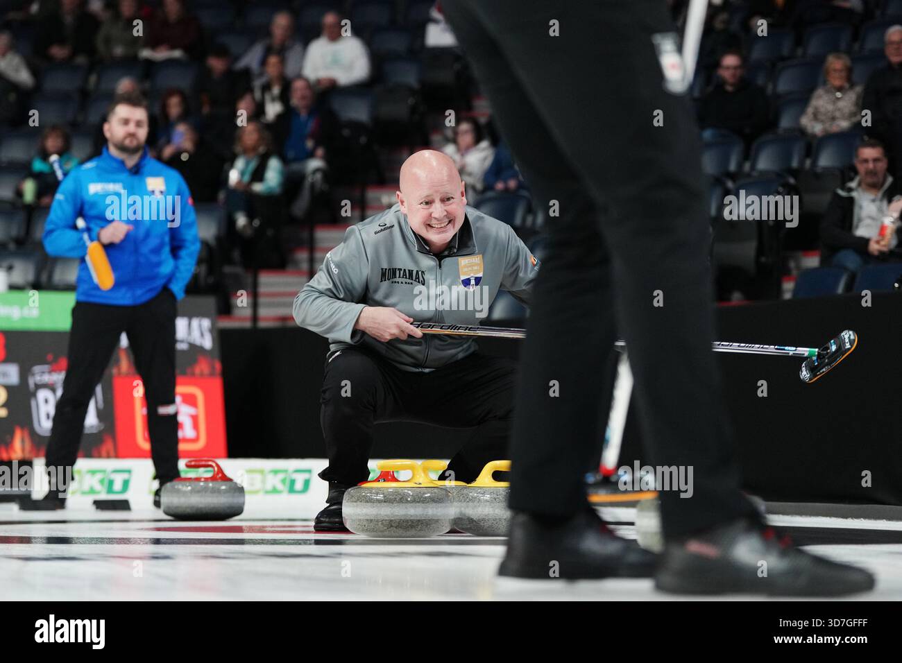 Kevin Koe reacts to a shot in the house as Matt Dunstone looks on ...