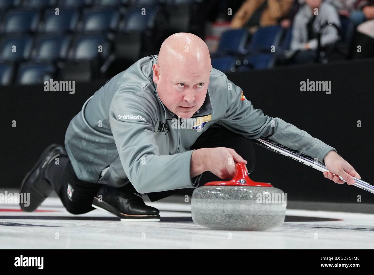 Kevin Koe throws a rock during Canadian Olympic curling trials action ...