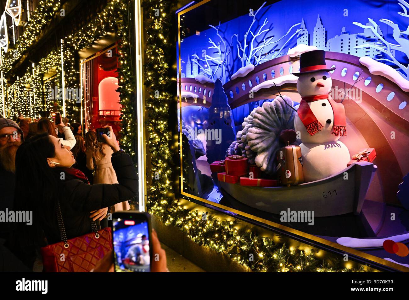 Saks Fifth Avenue holiday light show and window reveal on Monday, Nov. 24, 2025, in New York ...