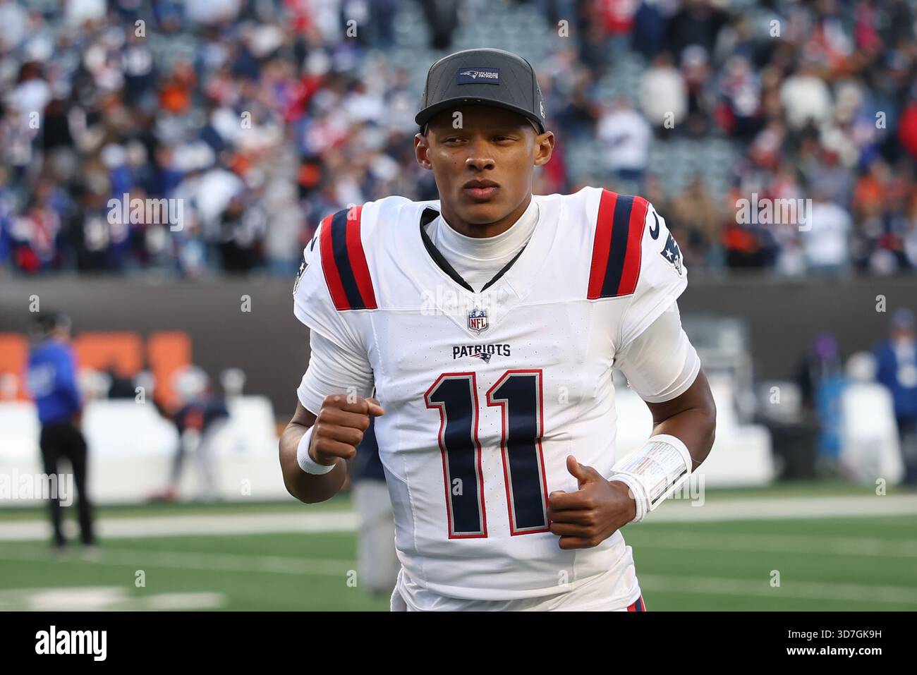 New England Patriots quarterback Joshua Dobbs (11) leaves the field ...
