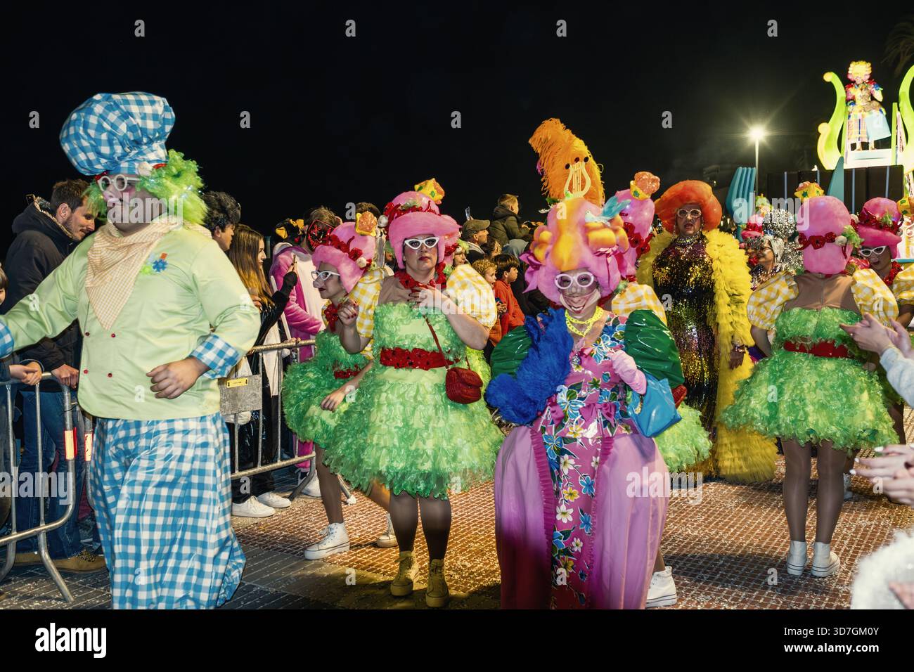Group of people dressed in vibrant drag queen costumes with elaborate ...